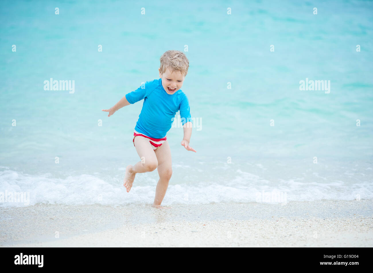Running in the waves hi-res stock photography and images - Alamy