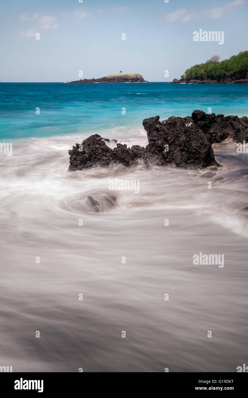Incoming tide and turquoise coloured sea at a Bali beach captured using ...