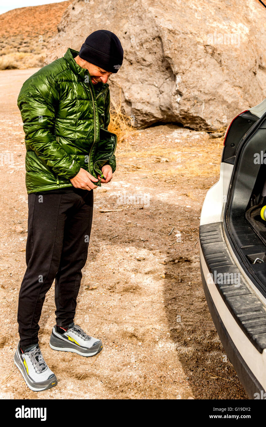 Putting on jacket hi-res stock photography and images - Alamy