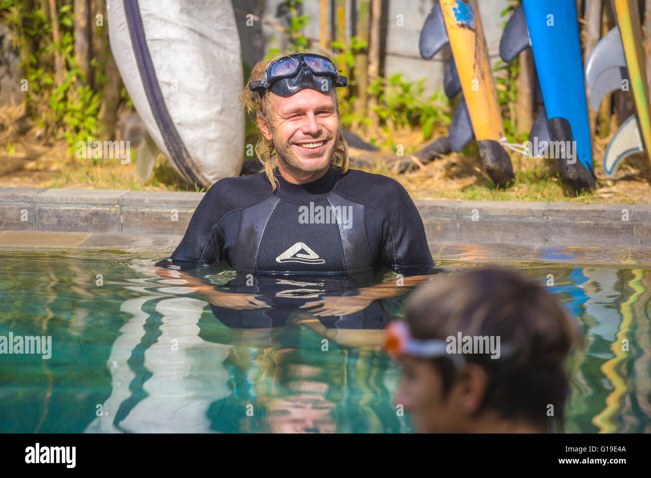 Portrait a young man with dive mask in pool in freediving training time ...