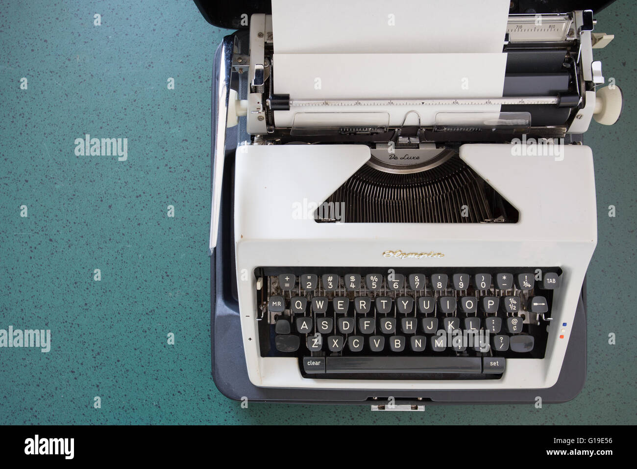 Portable metal typewriter, circa 1970, on a green desk in its open ...