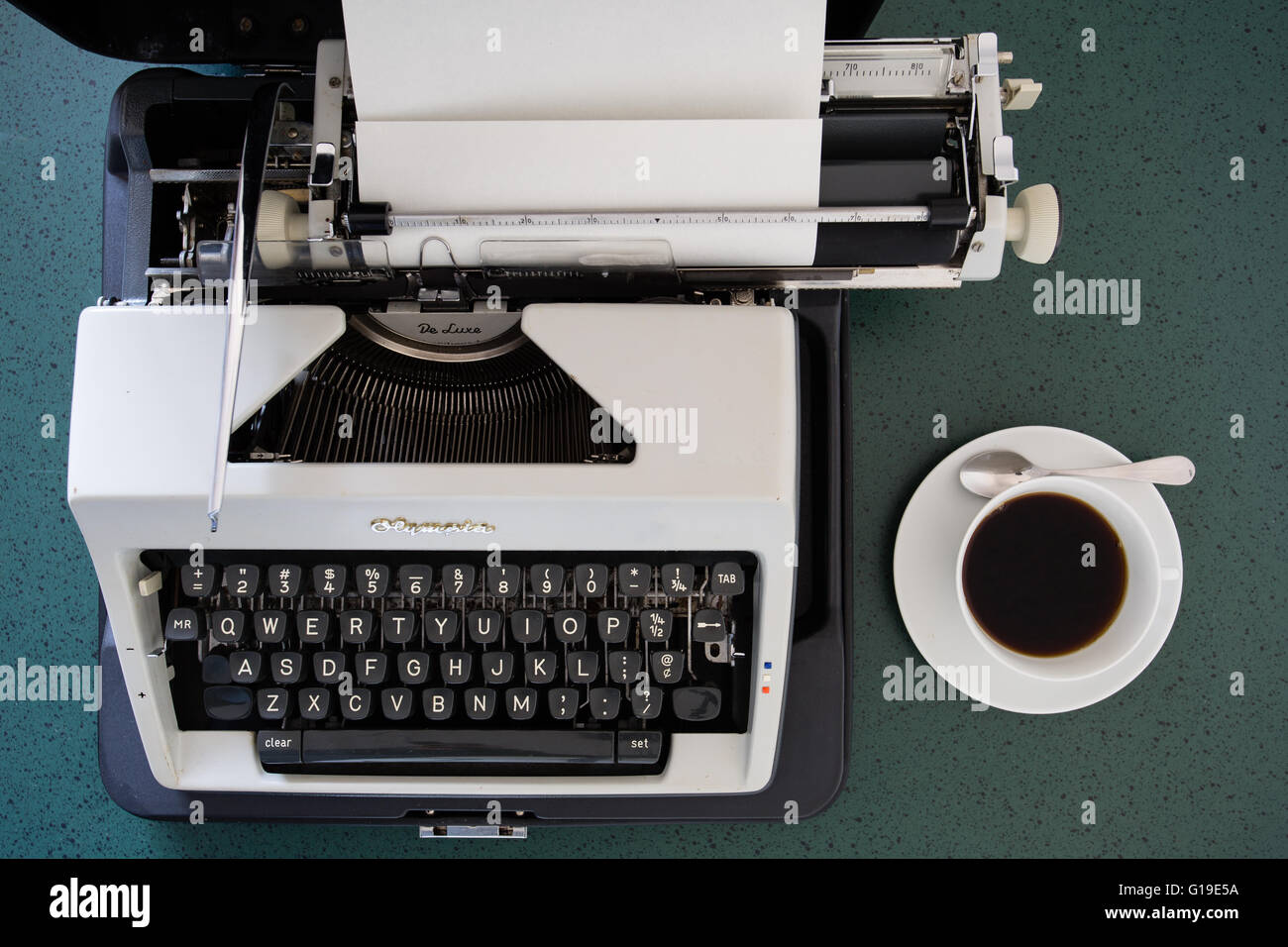 Portable metal typewriter, circa 1970, on a green desk in its open ...