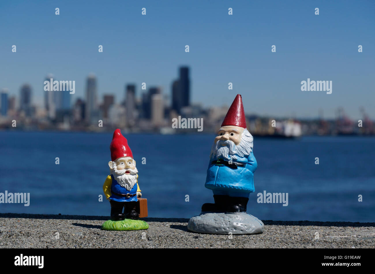Two garden gnomes at Alki Beach with Puget Sound and Seattle ...