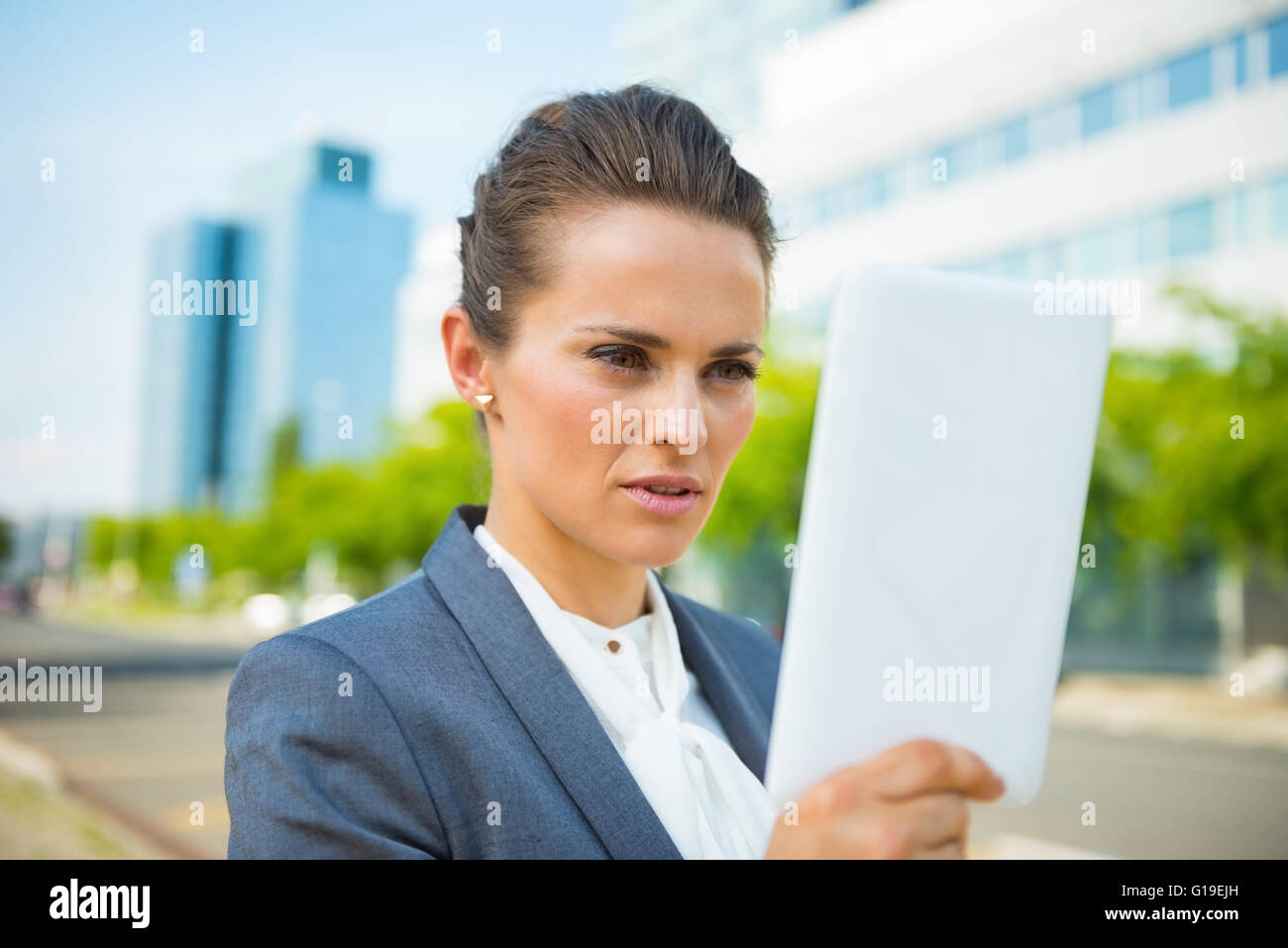 Into the ultra-modern business trends. Business woman using tablet PC ... Into the ultra-modern business trends. Business woman using tablet PC ...