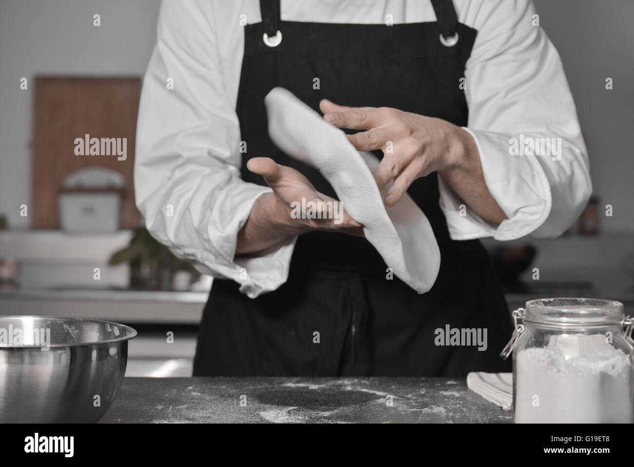 Chef cooking pizza in kitchen with hands Stock Photo - Alamy