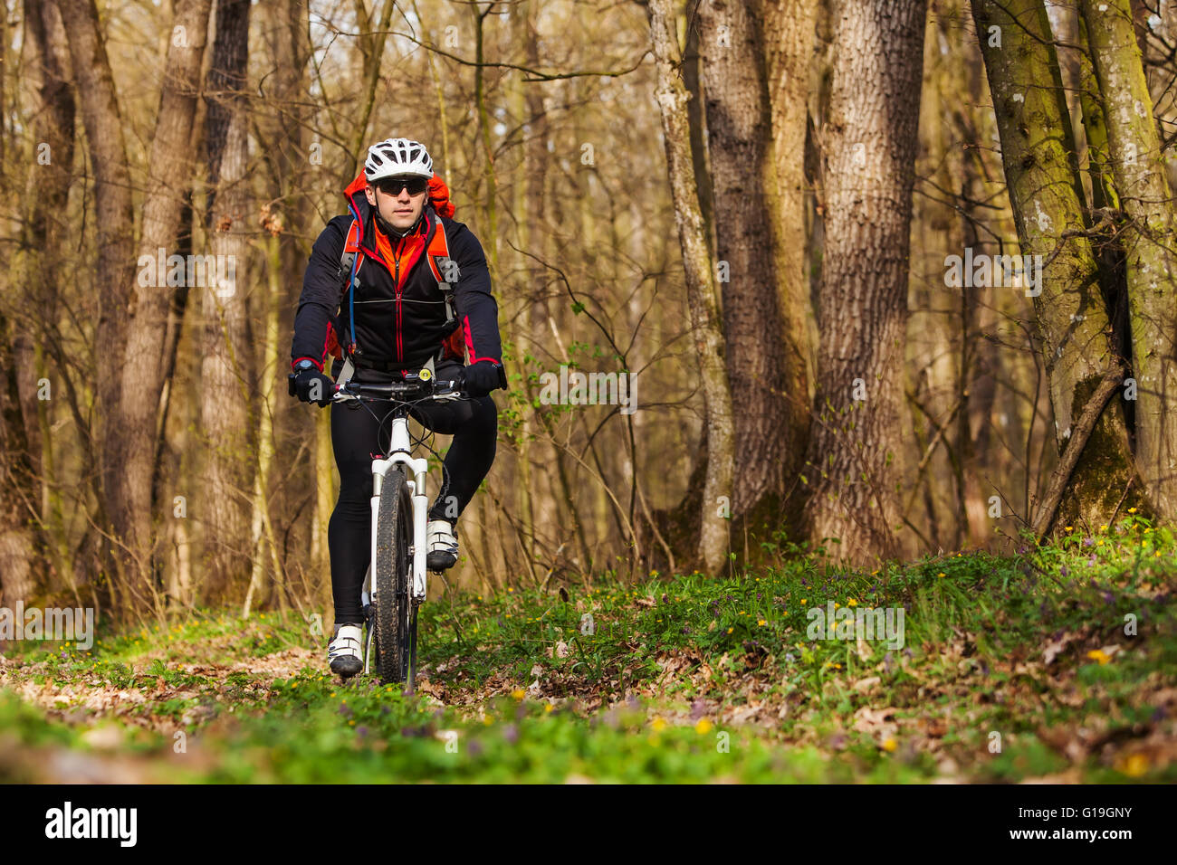 Man cyclist riding the bicycle Stock Photo - Alamy