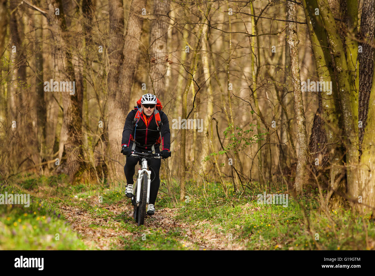 Man cyclist riding the bicycle Stock Photo - Alamy