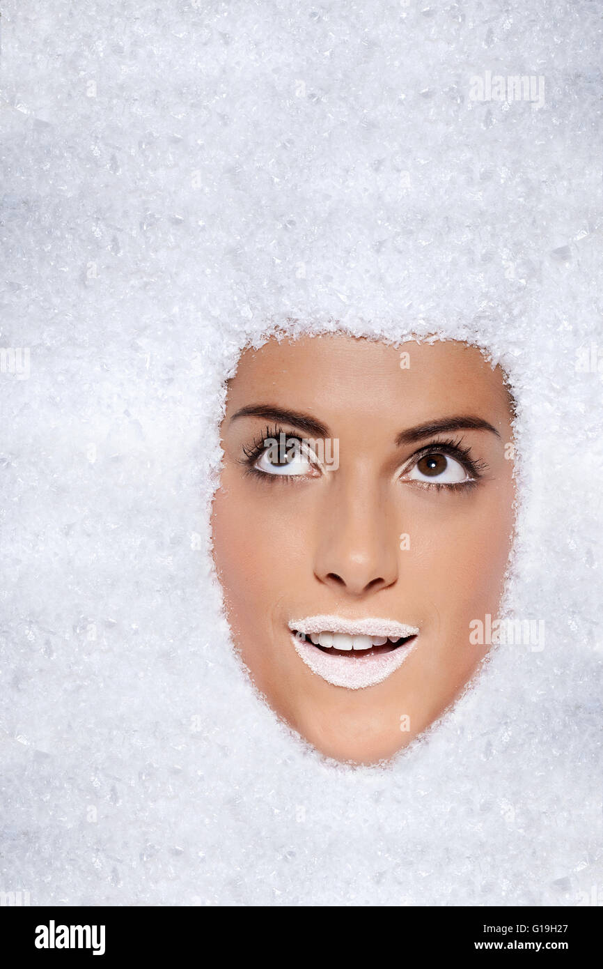 Beautiful woman covered in snow Stock Photo - Alamy
