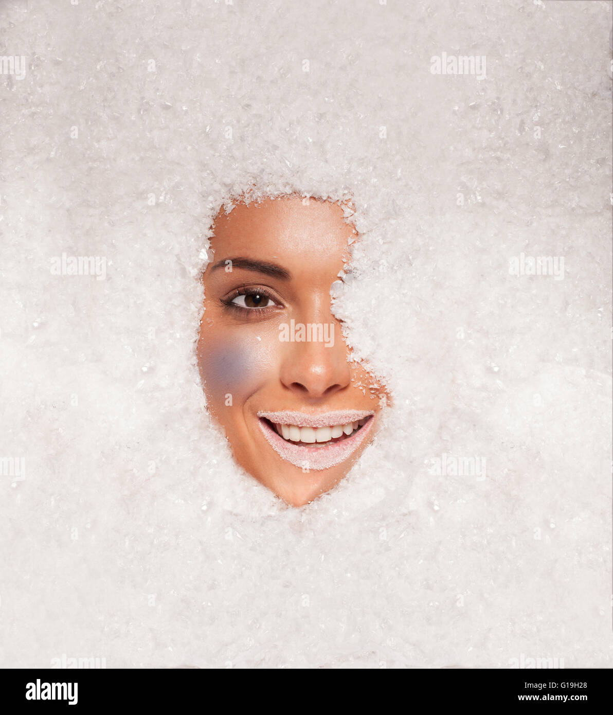 Beautiful woman covered in snow Stock Photo - Alamy