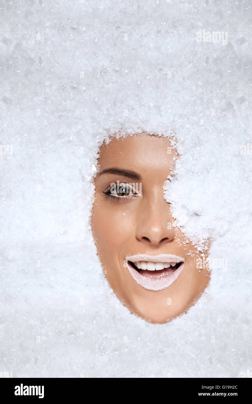 Beautiful woman covered in snow Stock Photo - Alamy