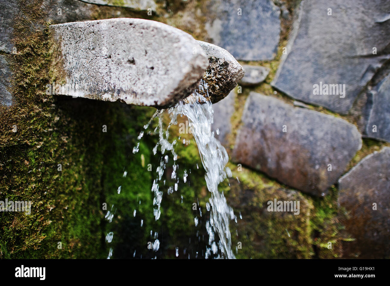 Source water from stone channel Stock Photo - Alamy