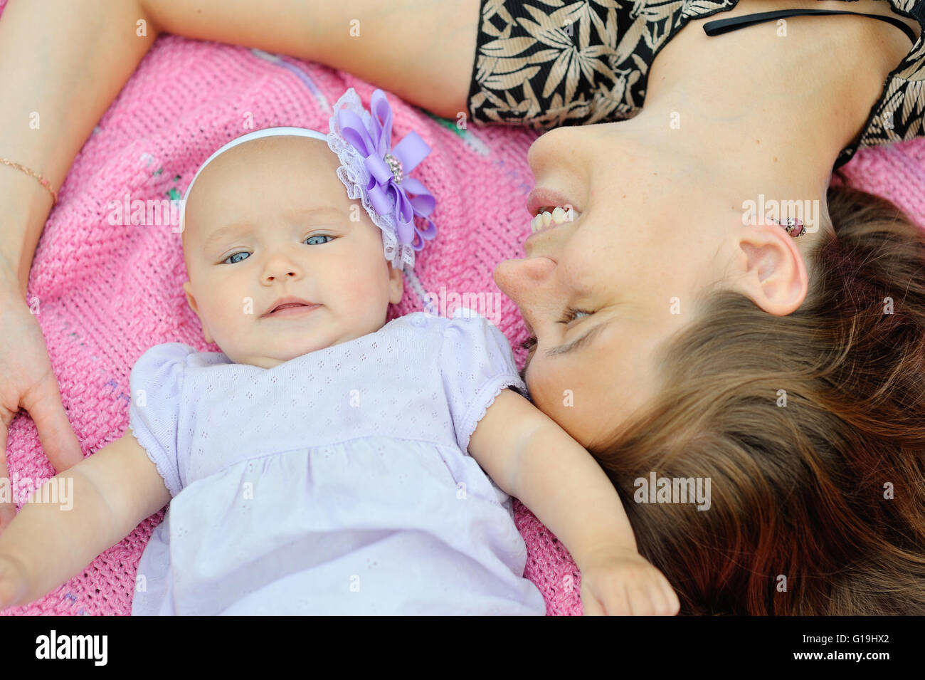 Mother and baby in park portrait Stock Photo - Alamy