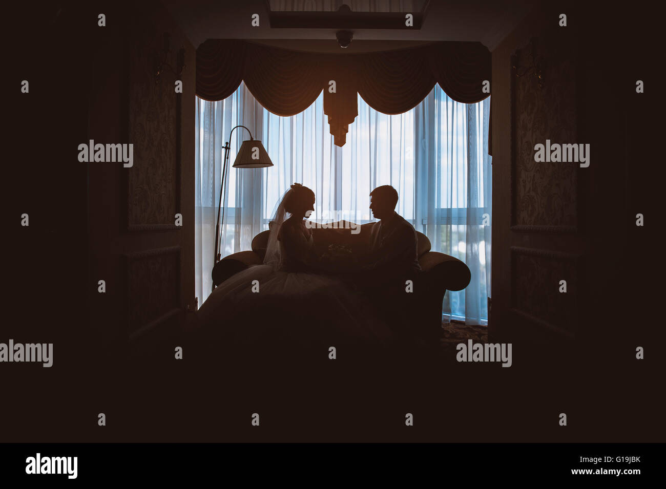 Silhouette bride groom sitting on hi-res stock photography and images ...