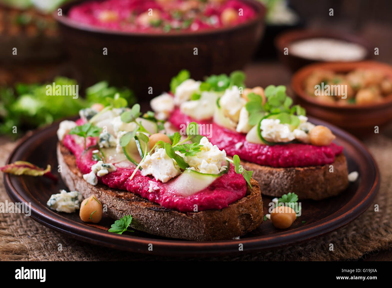 Vegan sandwiches with beetroot hummus, cucumber and blue cheese Stock ...