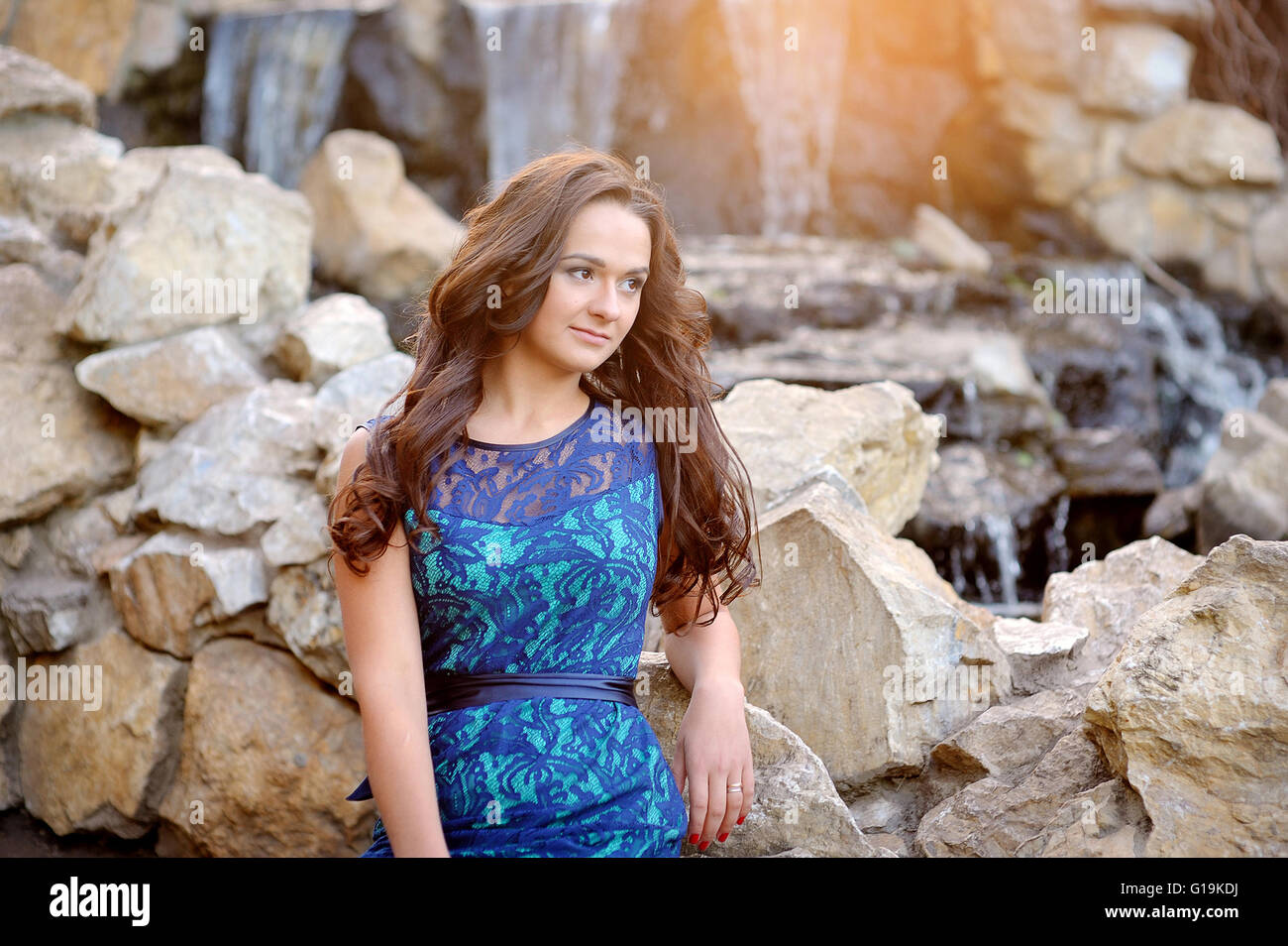 girl thinking on a background of a waterfall Stock Photo - Alamy