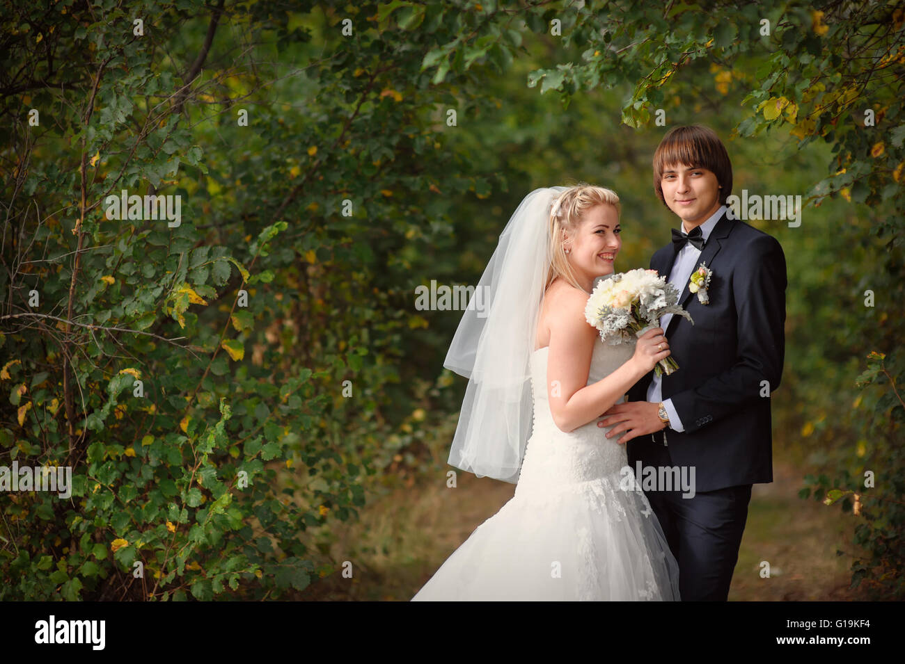 Happy wedding couple smiling together hi-res stock photography and ...