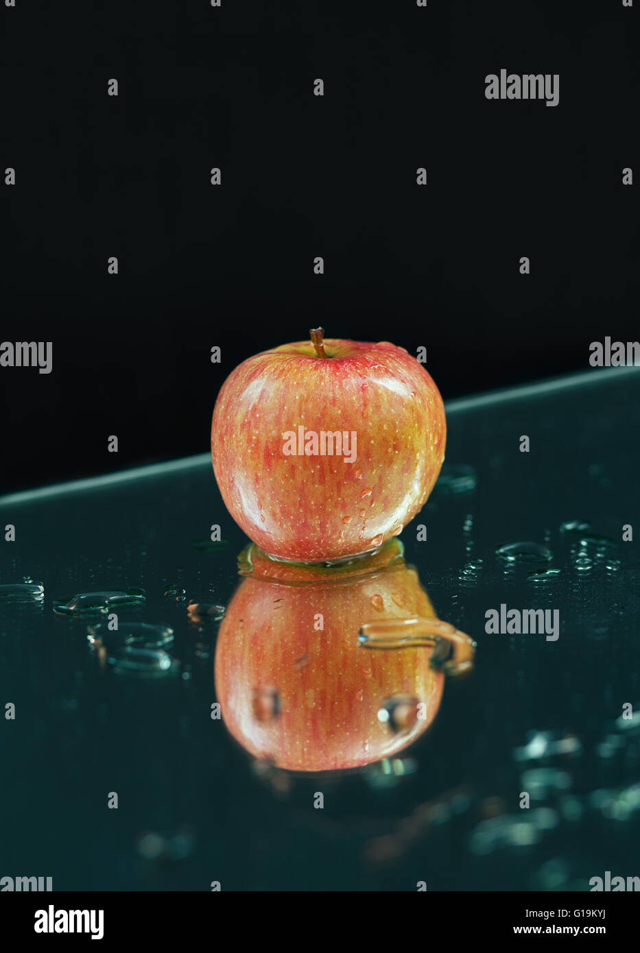 Fresh Apple on Mirror Stock Photo - Alamy