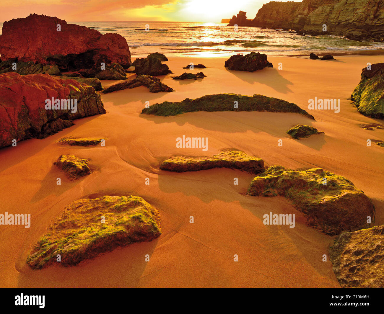 Sunset with rocks and sand hi-res stock photography and images - Alamy