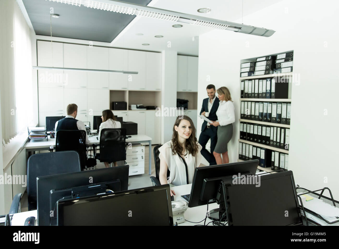 Woman working on the computer in the office Stock Photo - Alamy
