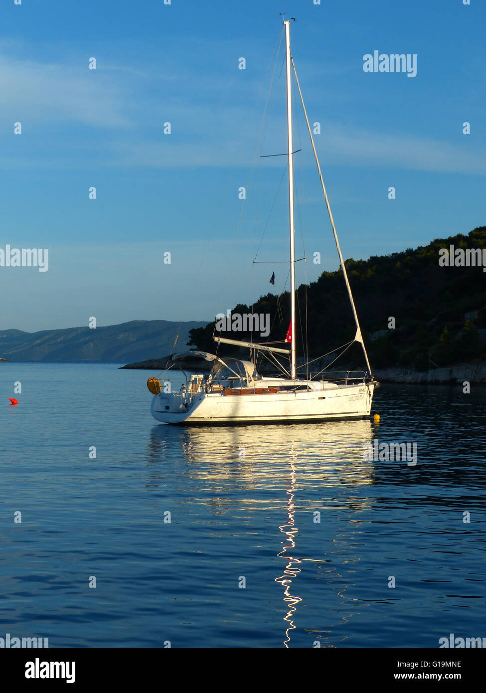 sailboat anchoring in bay Stock Photo - Alamy