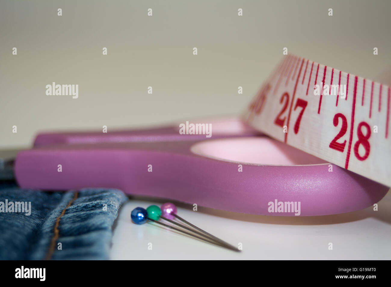 Close-up image of scissors, cloth, pins and tape measure Stock Photo ...