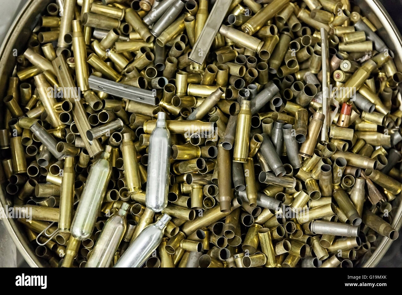 Bucket full of shell casings of bullets used Stock Photo - Alamy