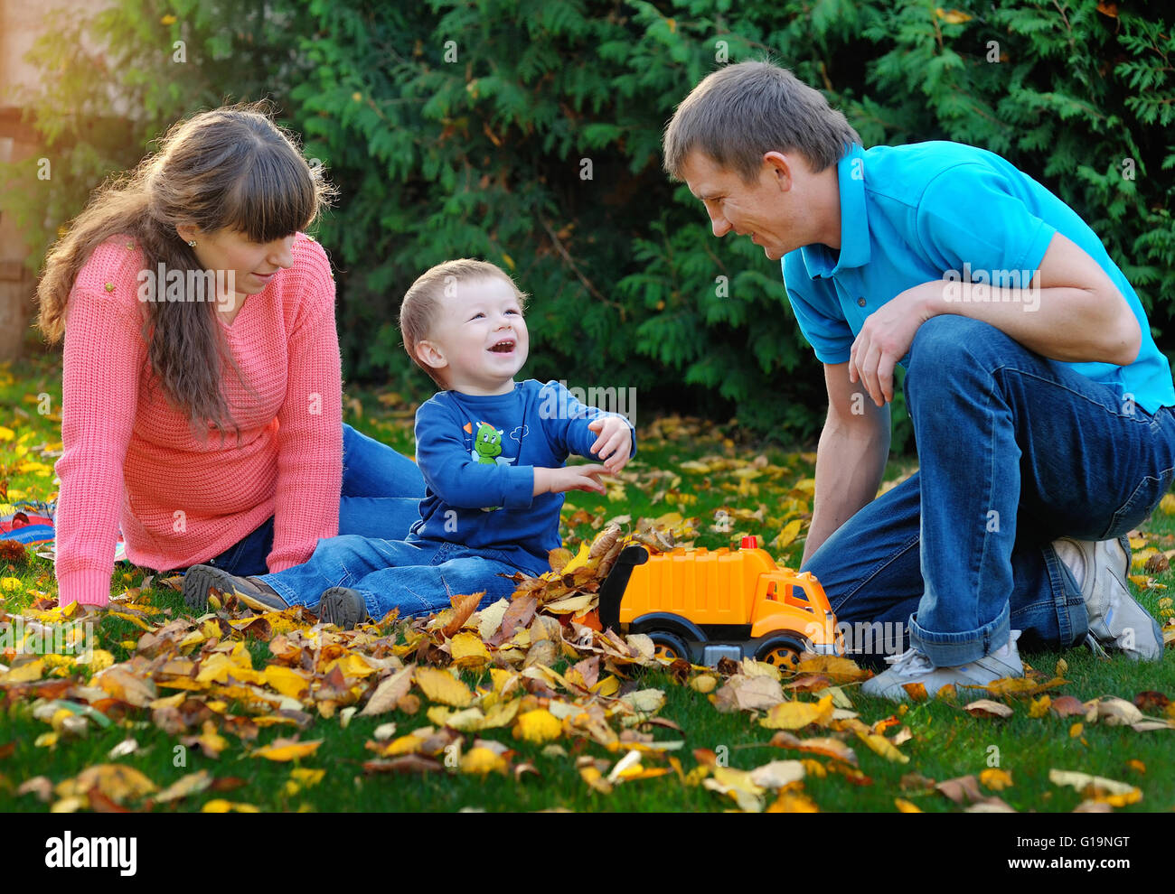 happy family playing in the park in autumn Stock Photo - Alamy