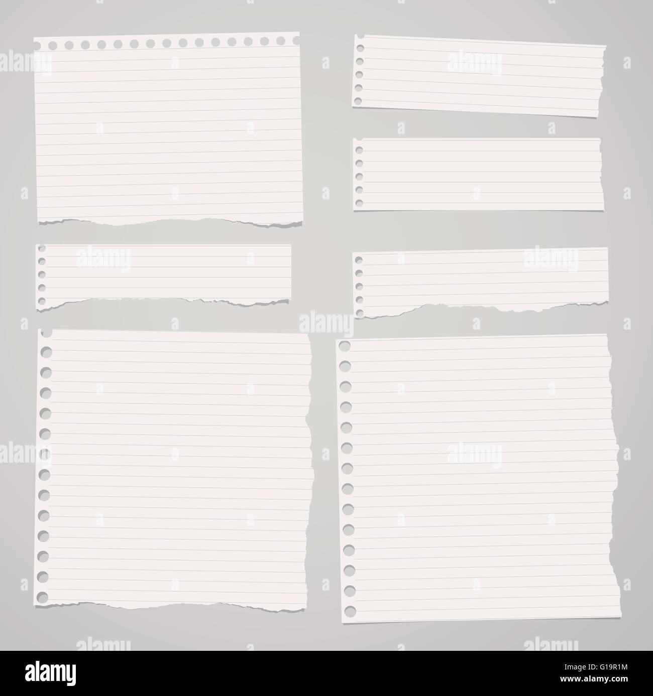 Pieces of ripped white lined notebook paper are stuck on light brown ...