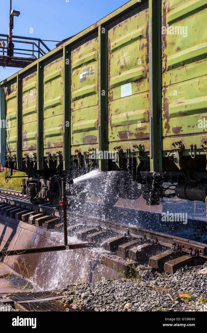 water washing of old freight railway cars Stock Photo - Alamy