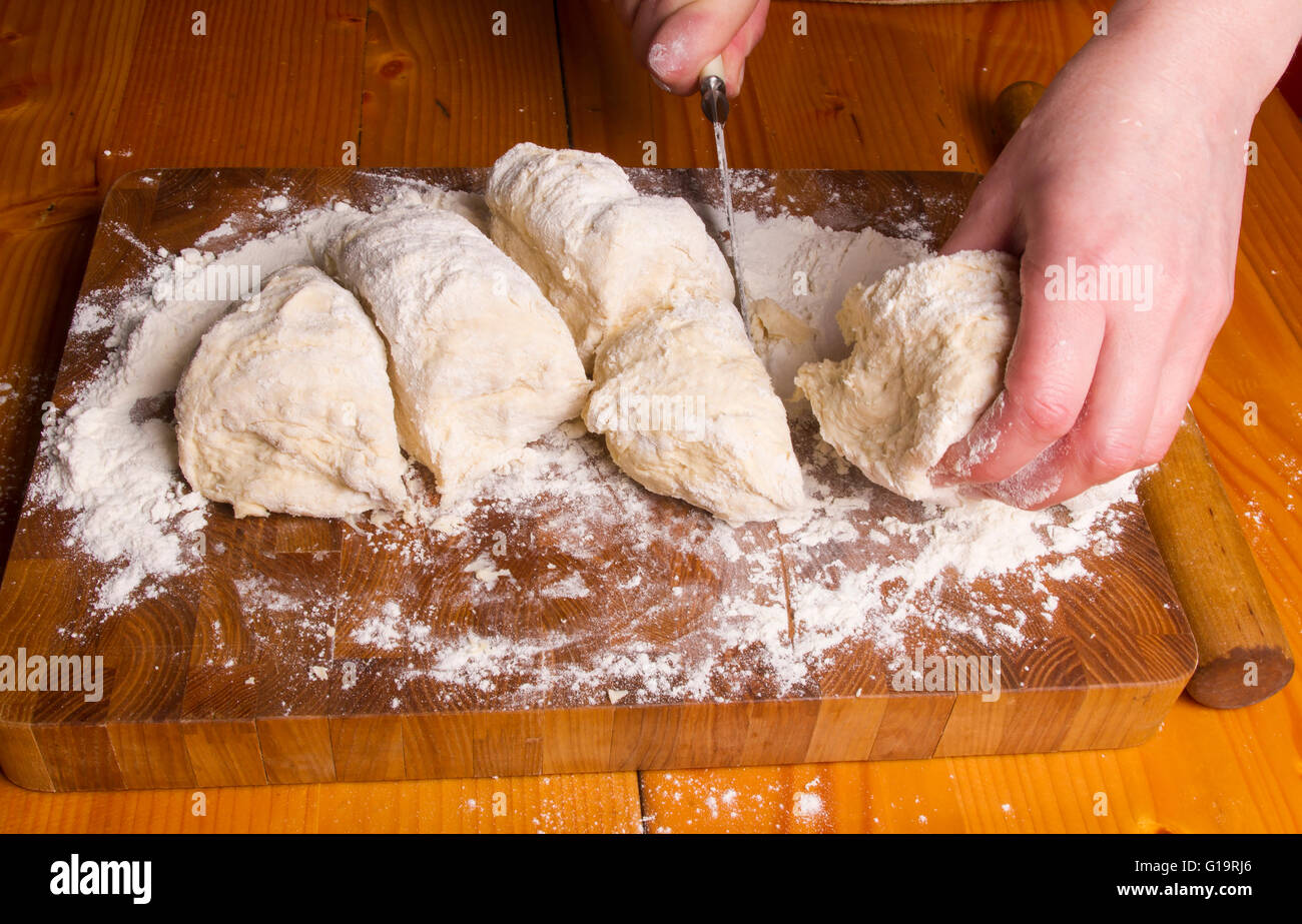 Making dough by female hands on wooden table background Stock Photo - Alamy