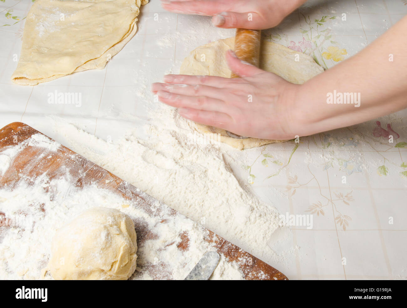 Making dough by female hands on wooden table background Stock Photo - Alamy