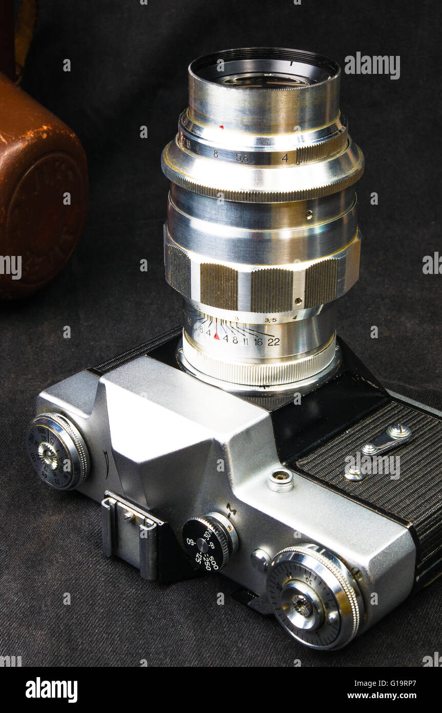 old vintage Soviet camera with leather case on black background Stock ...