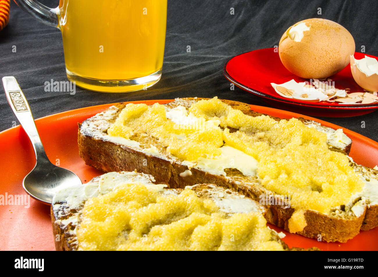 the bachelor dinner - toast with butter and yellow caviar, boiled eggs ...