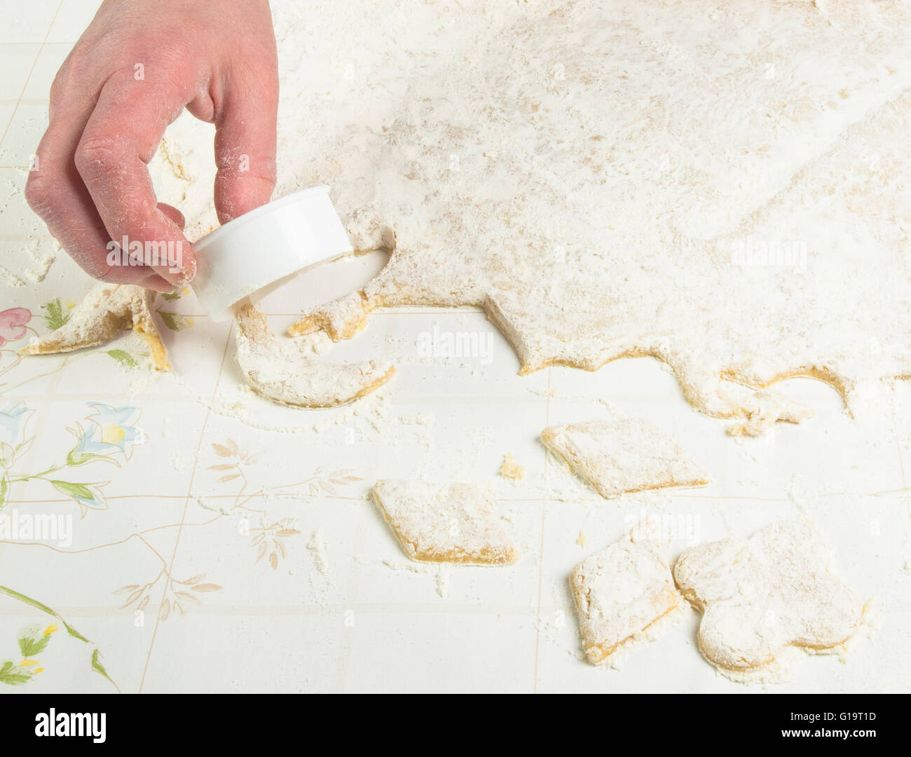 making homemade sugar cookies - woman's hands, form a dough and the ...