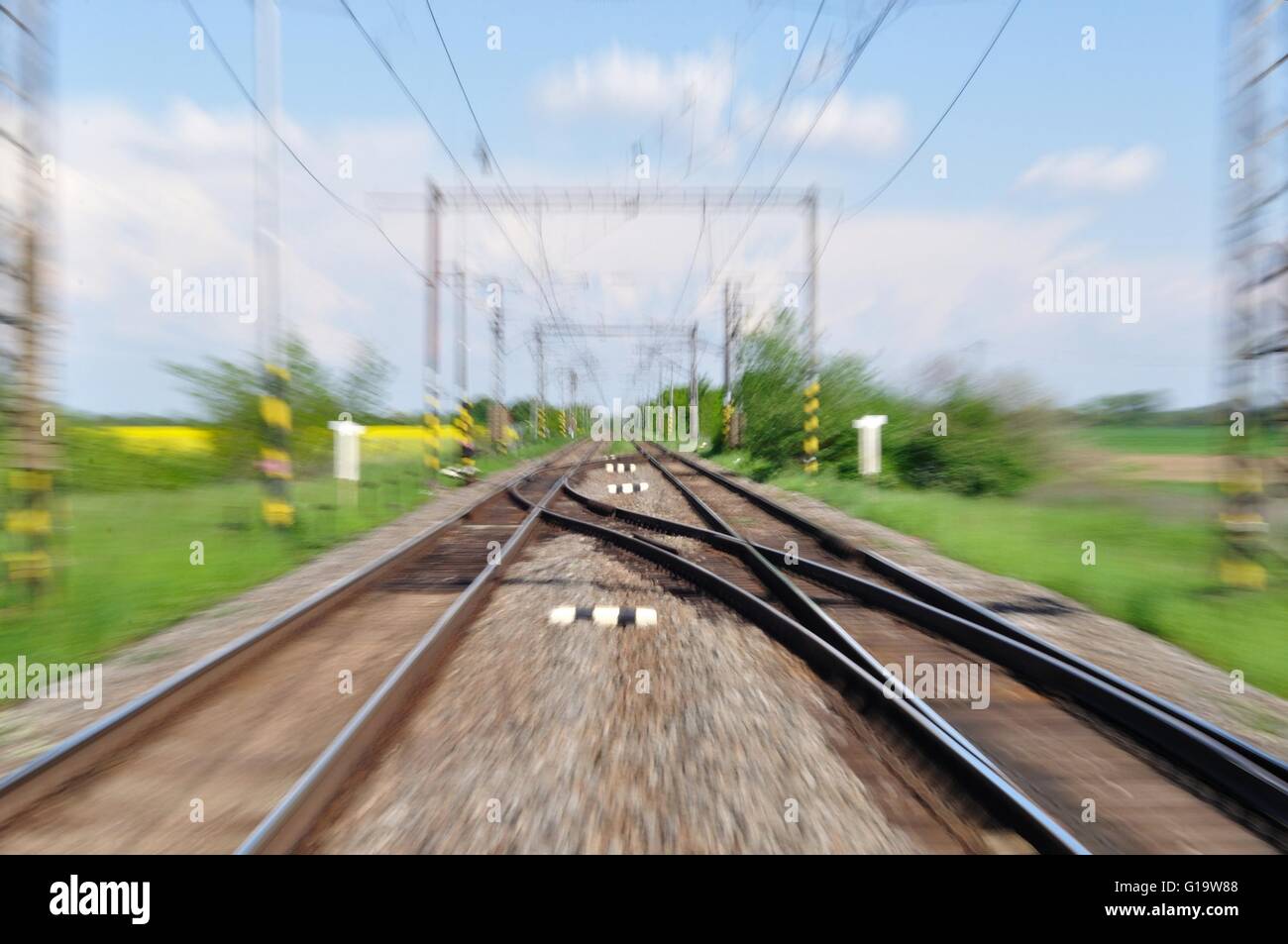 Two long railway tracks. Blurred with zoom Stock Photo - Alamy
