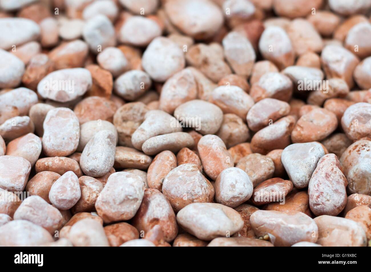 Background of small red rocks. Shallow DOF. Selective focus Stock Photo ...