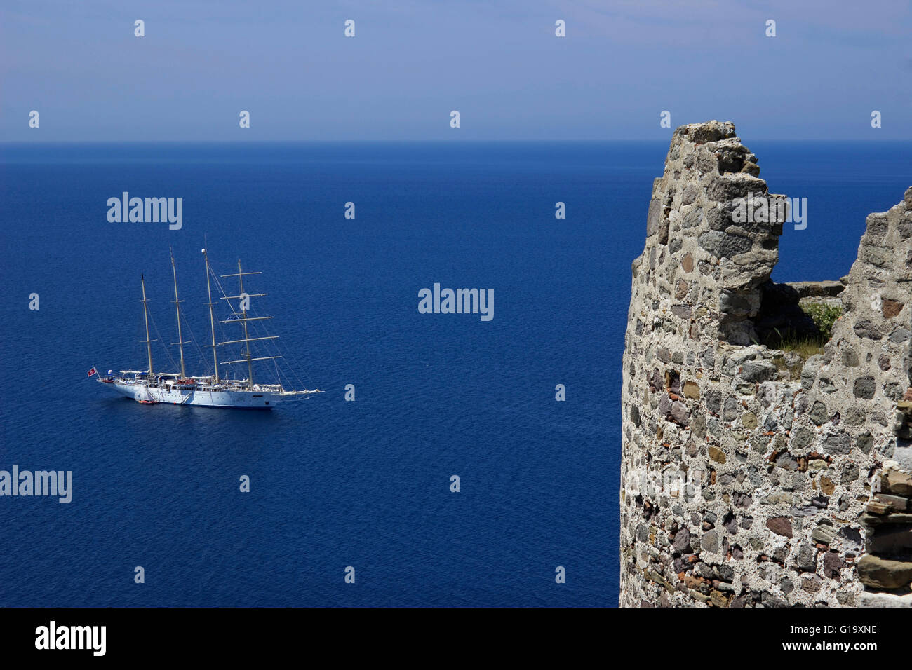 Myrina's crenellated castle tower walls overlooking the anchored ...