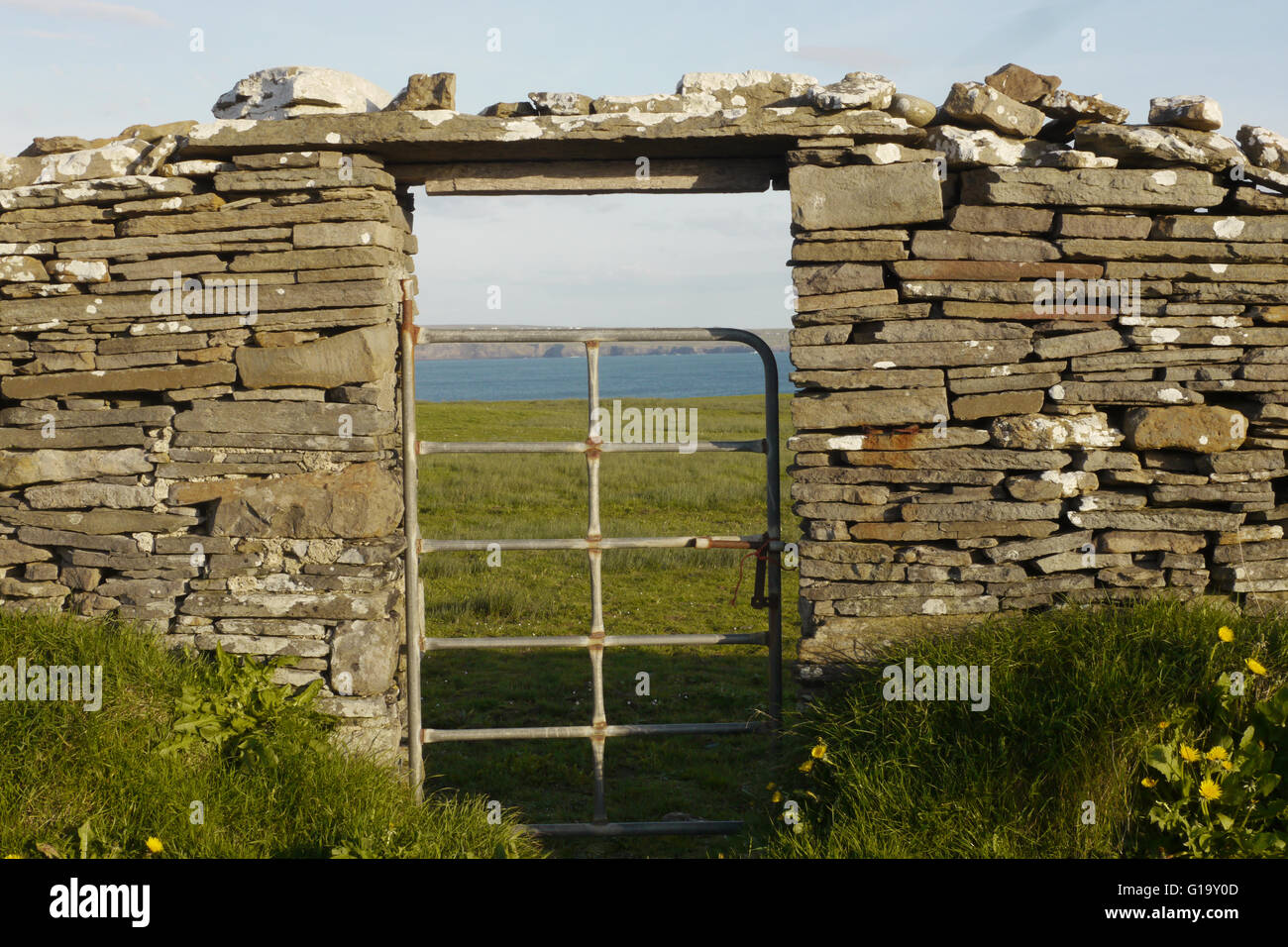 Irish gate in a wall leading to the sea Stock Photo - Alamy
