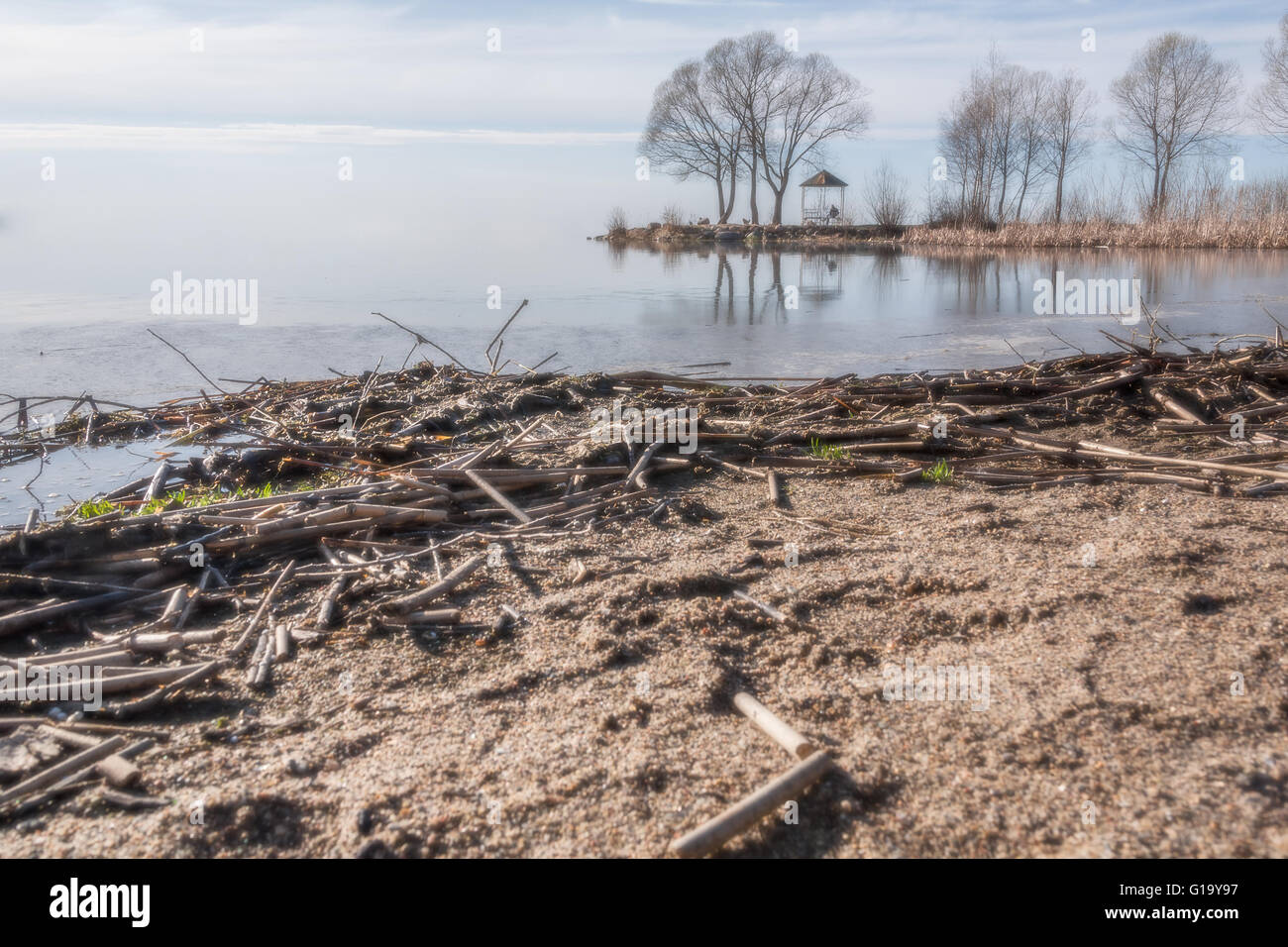 the man on the spring coast looks around at the horizon Stock Photo - Alamy