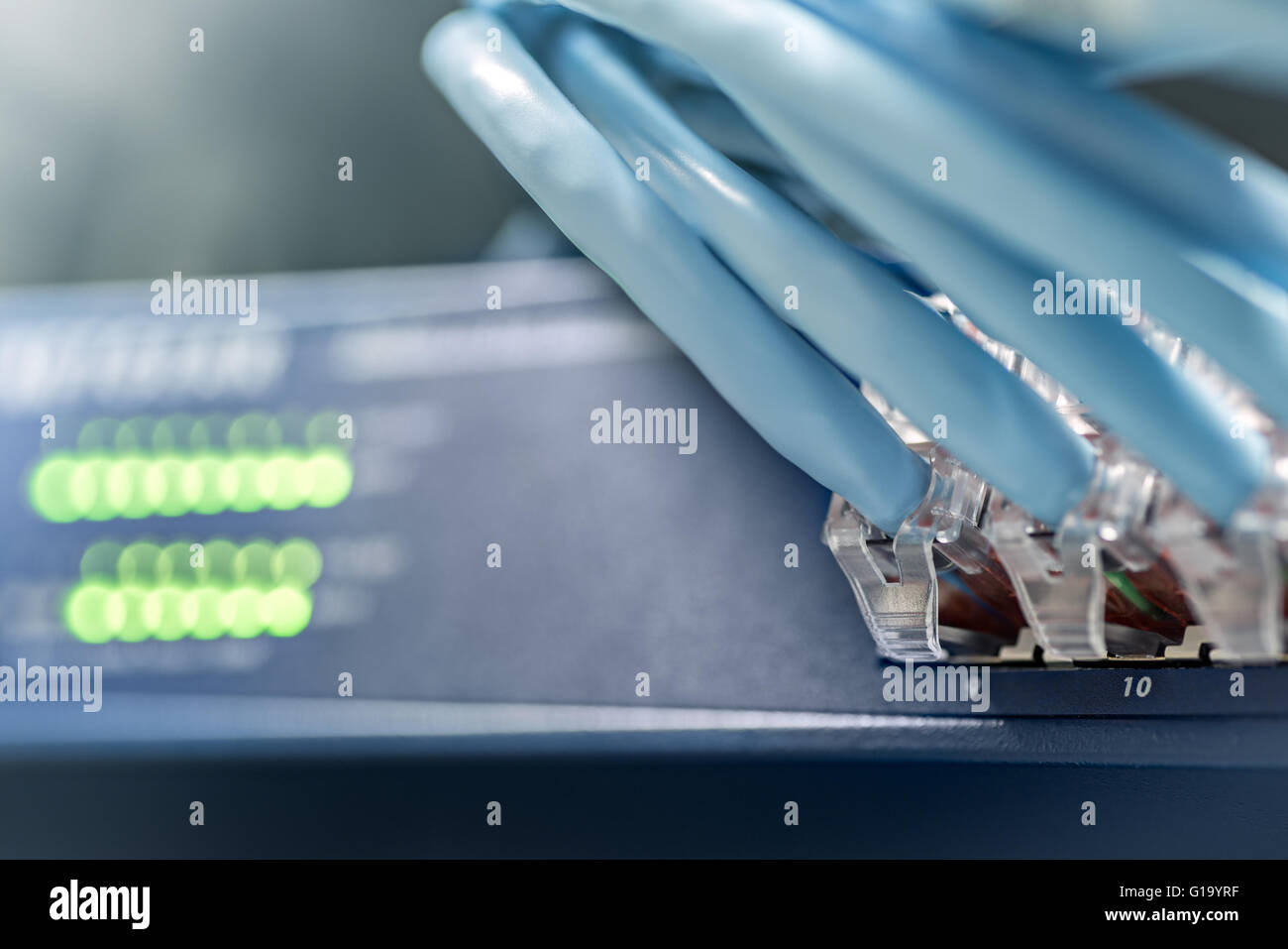 Gigabit switch with connected cables inside server rack Stock Photo - Alamy