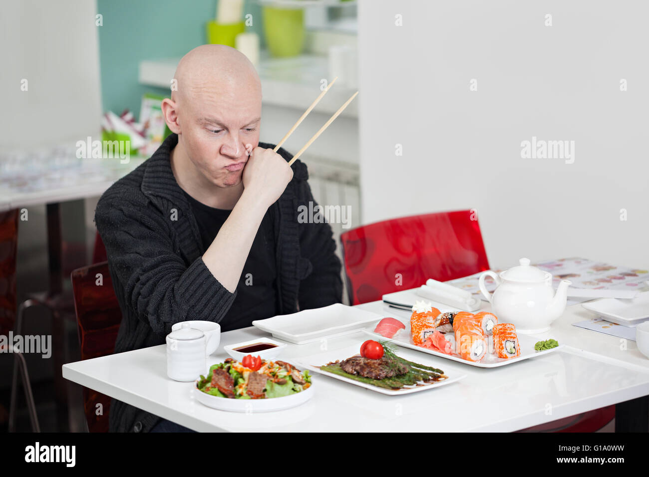 Bald man sitting restaurant table hi-res stock photography and images ...