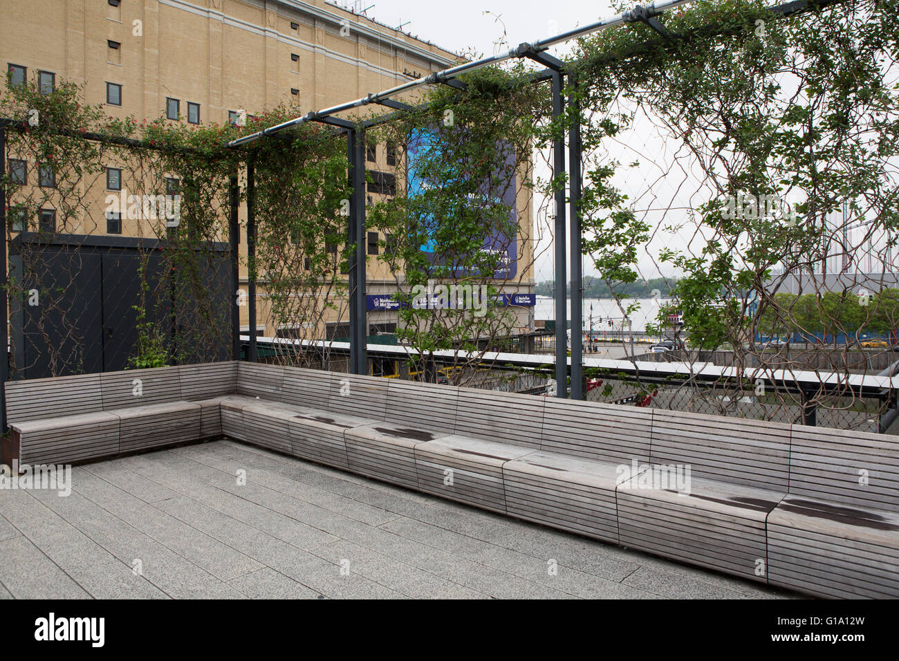 Seating next to creepers growing on the High Line in New York City, USA ...
