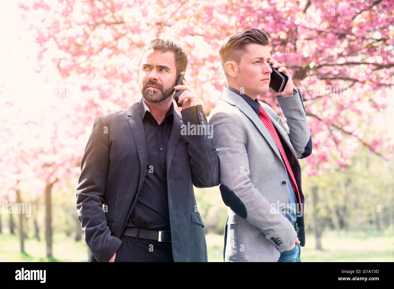 Two men standing talking outside hi-res stock photography and images ...