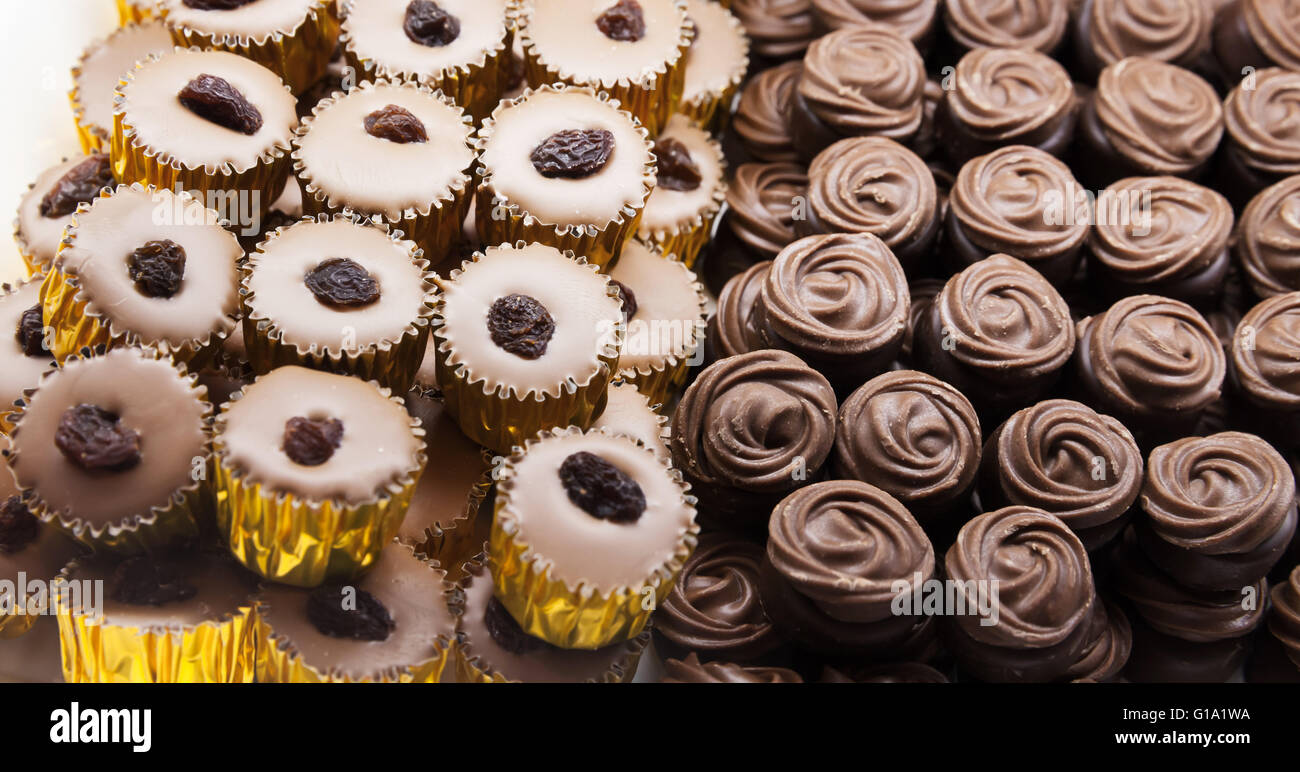 Luxury chocolate candies lay on market counter, closeup photo with ...