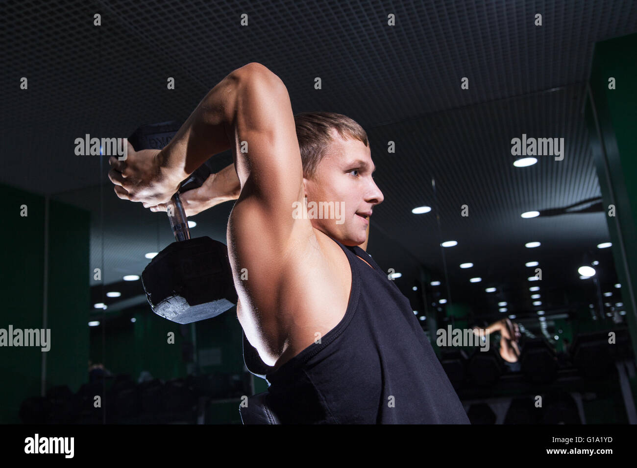 Man dumbbell extension gym hi-res stock photography and images - Alamy