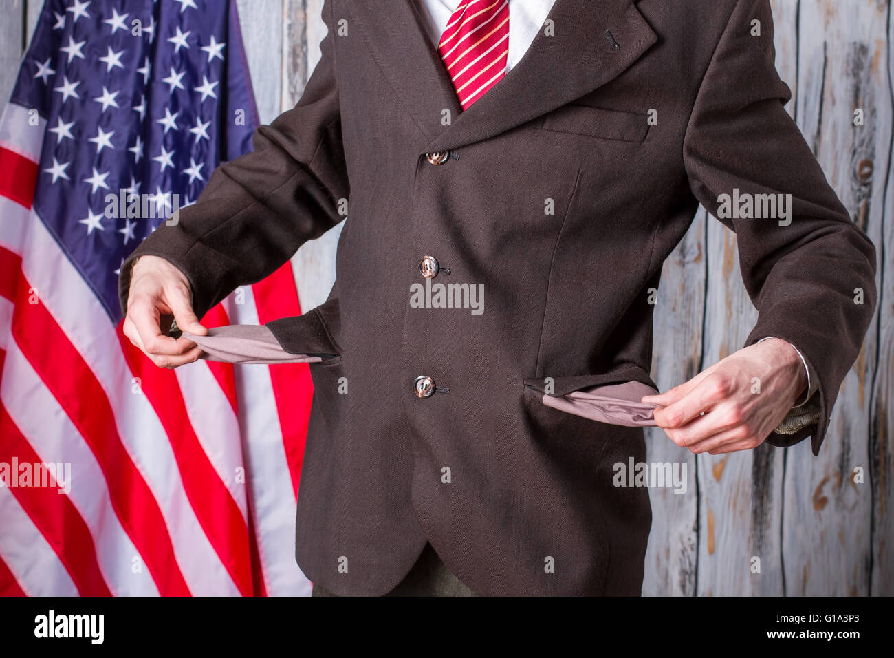 Businessman shows empty pockets Stock Photo - Alamy