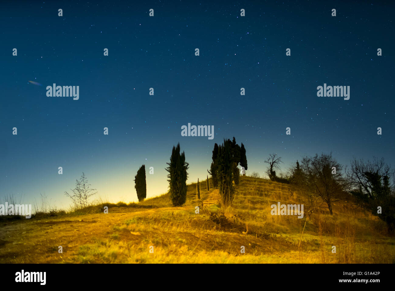 Starry night on the hill in Italy Stock Photo - Alamy