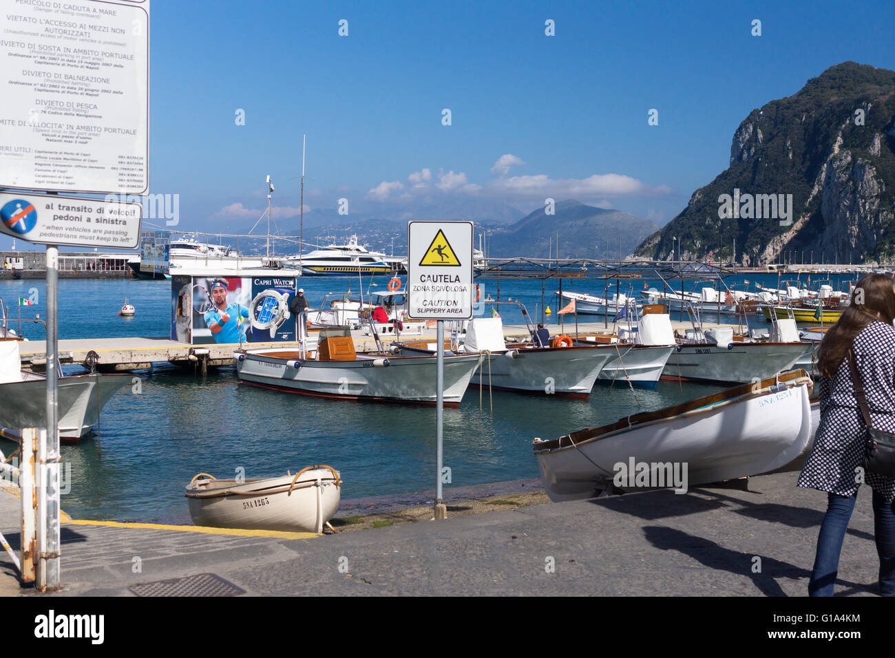 Small dinghies and large boats moored, including ferries to the ...