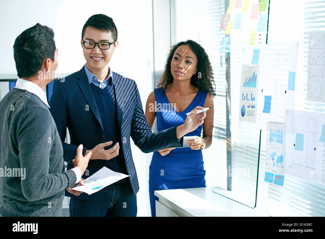 Asian business colleagues planning work together Stock Photo - Alamy