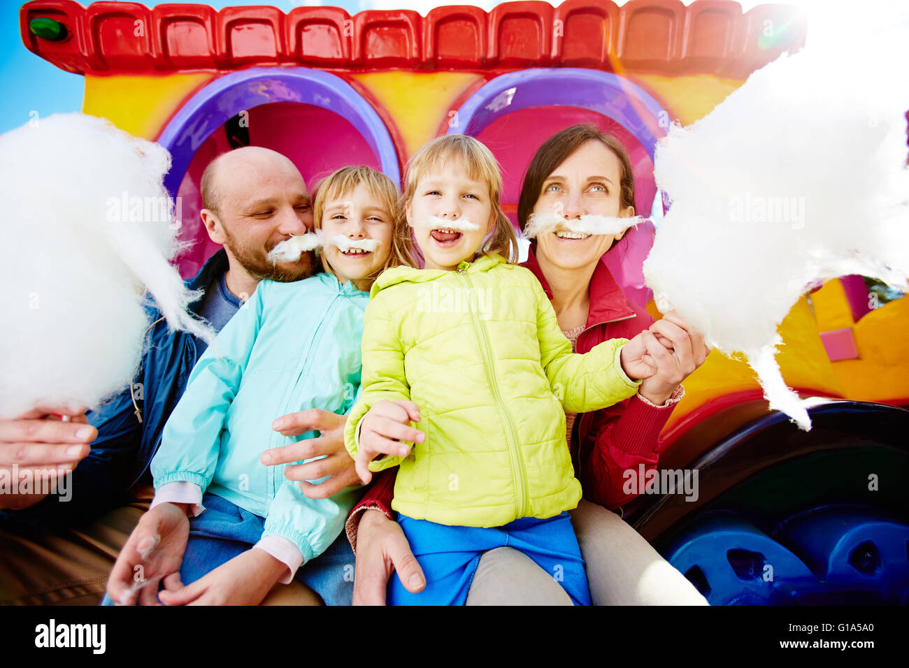 Siblings with parents Stock Photo - Alamy